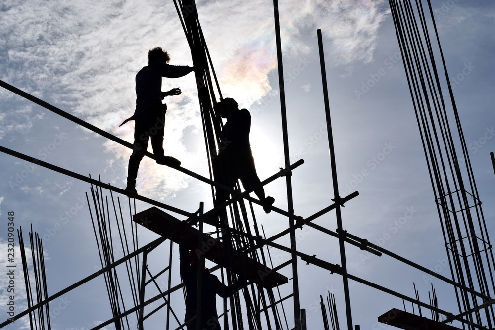 Filipino Construction steel workers assembling steel bars on high-rise ...
