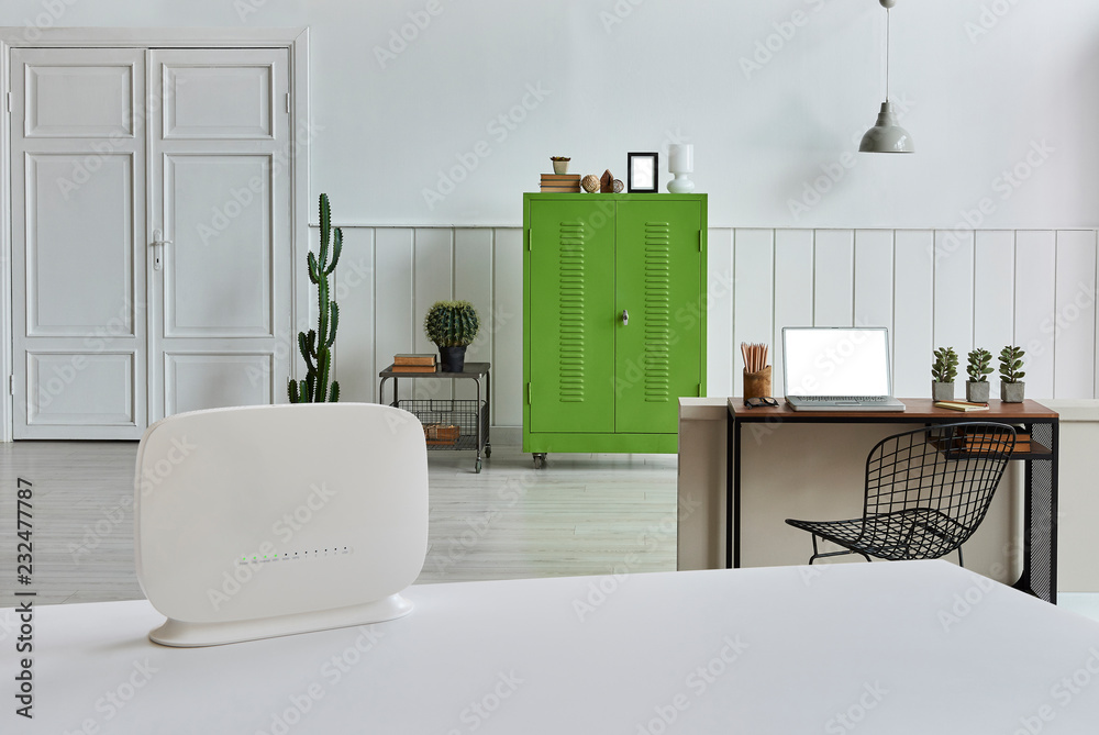 Router and Modem internet box close up and on the white table. Modern ...