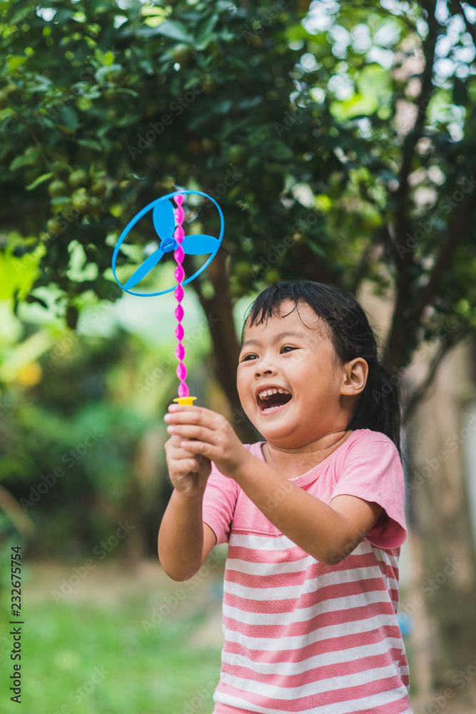 Asian children playing Push UFO flying wheel toys Plastic Stock Photo ...