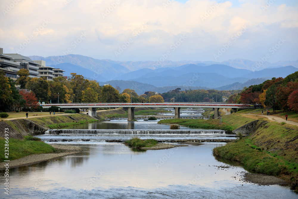 Beautiful morning light reflects off water flowing down Kamo River on ...