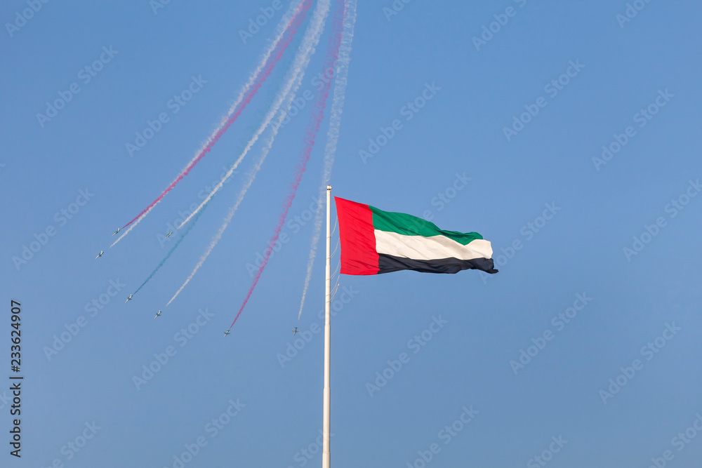 Aerobatic team flying over UAE flag in Abu Dhabi. National day ...