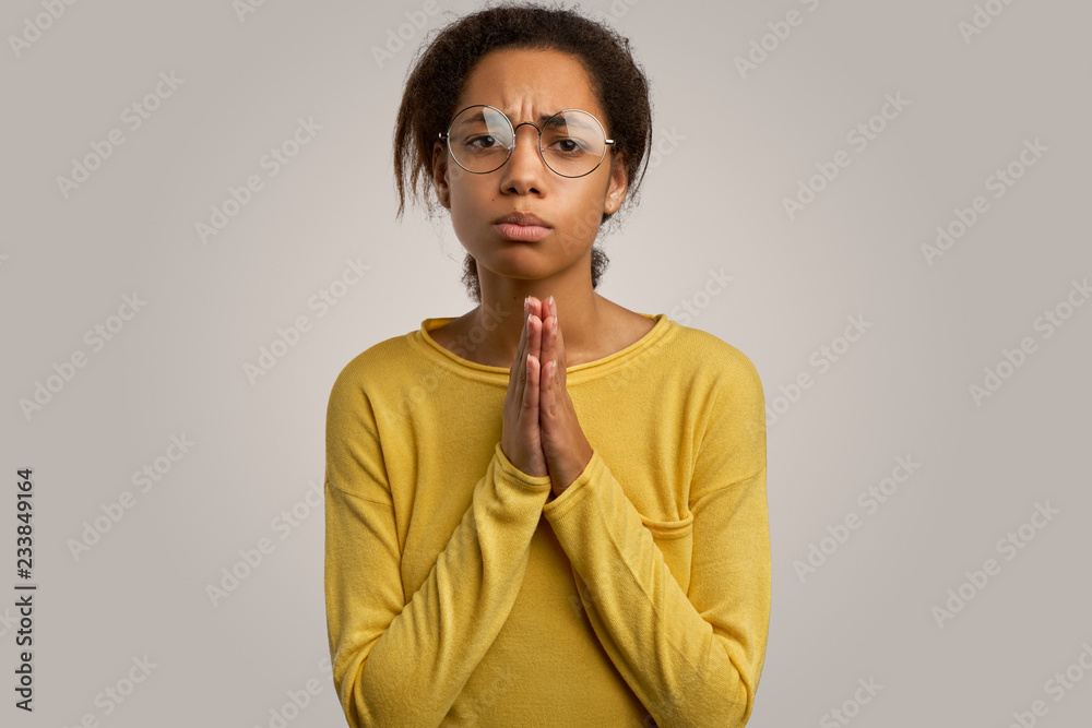 The photo of a begging cute young African American woman has a pitiful ...