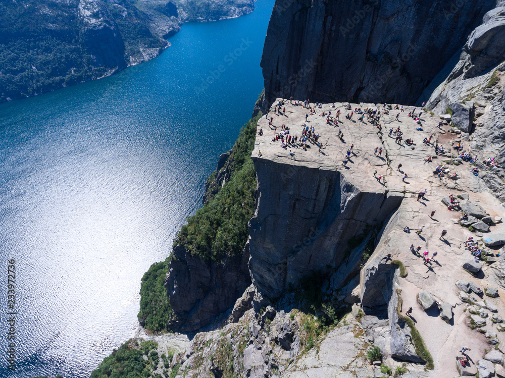 Giant rock Preikestolen over water of fjord Lysefjorden, natural ...
