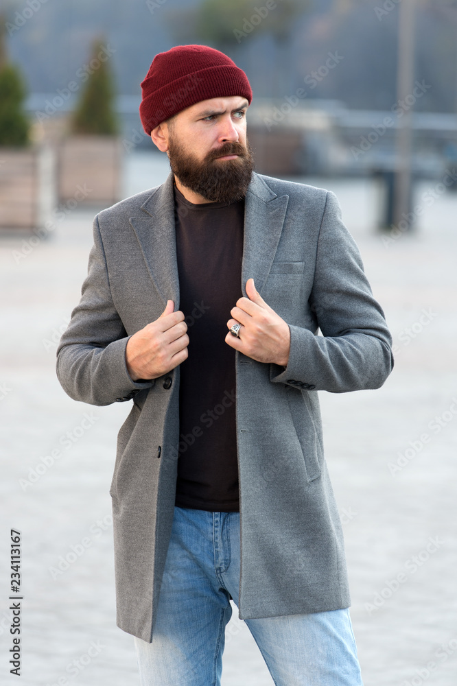 Stylish modern outfit hat bright accessory. Hipster outfit. Stylish casual outfit for fall and winter season. Menswear and male fashion concept. Man bearded hipster stylish fashionable coat and hat St...