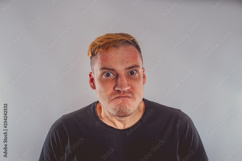 emotional portrait of a crazy guy in close-up. concept: the nervous ...