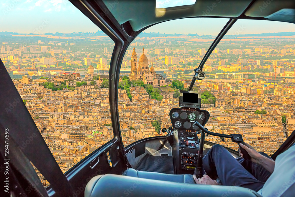 Helicopter cockpit flying on Montmartre hill skyline of Paris, French ...