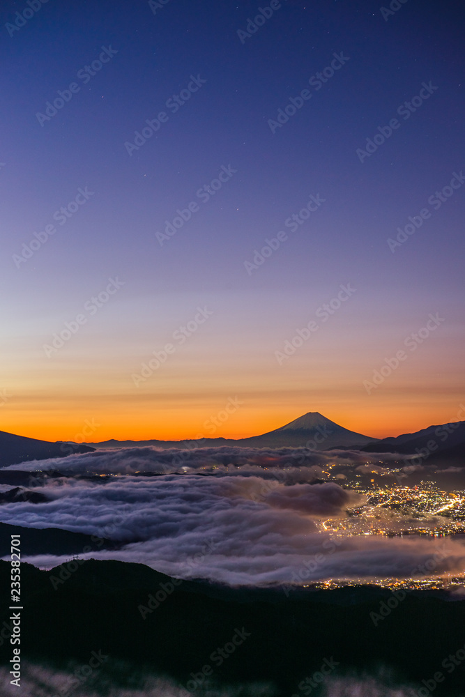 Dawning with lake suwa, mt fuji at yatsugatake on vertical position ...