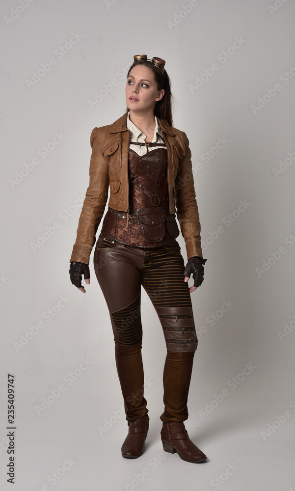 full length portrait of brunette girl wearing brown leather steampunk ...