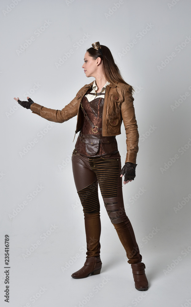 full length portrait of brunette girl wearing brown leather steampunk ...