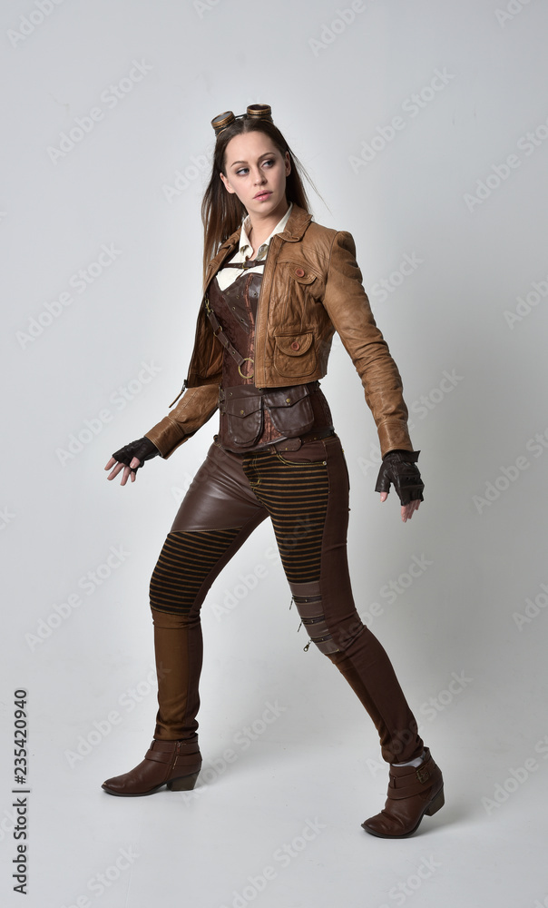full length portrait of brunette girl wearing brown leather steampunk ...