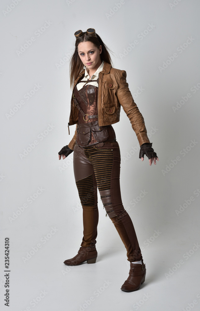 full length portrait of brunette girl wearing brown leather steampunk ...