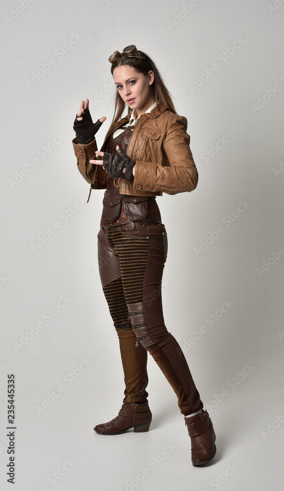full length portrait of brunette girl wearing brown leather steampunk ...