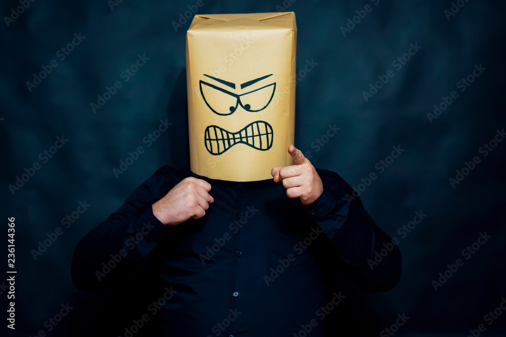 Emotion concept. One hand clenched into a fist. The index finger of the ...