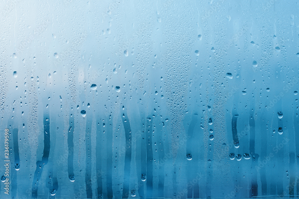 Condensation on the clear glass window. Water drops. Rain. Abstract ...