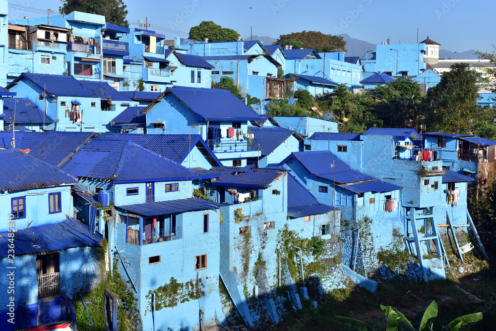 Panoramic view of village with old houses and rooftops painted in blue ...