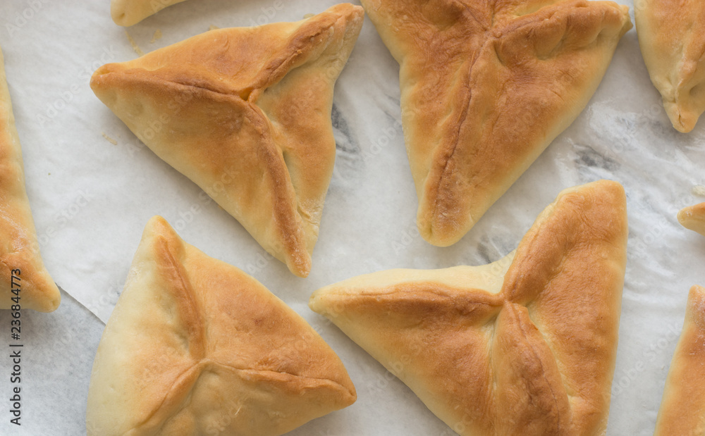 Yeast sweet buns n the shape of a triangle. Top view. Food photography ...
