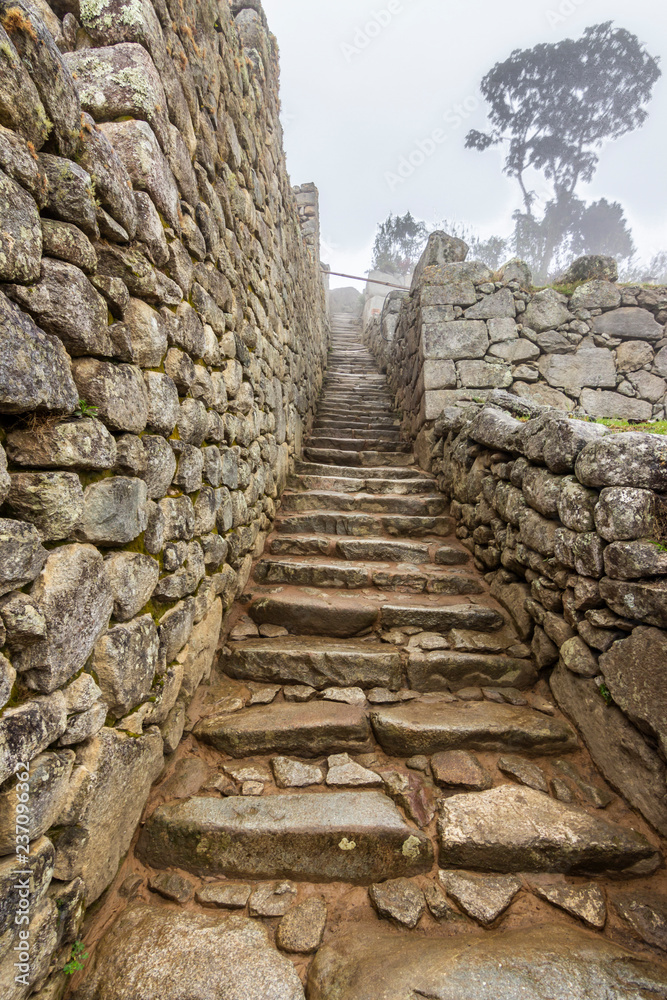 Photo Stock Following the Inca steps in the streets paths inside the ...