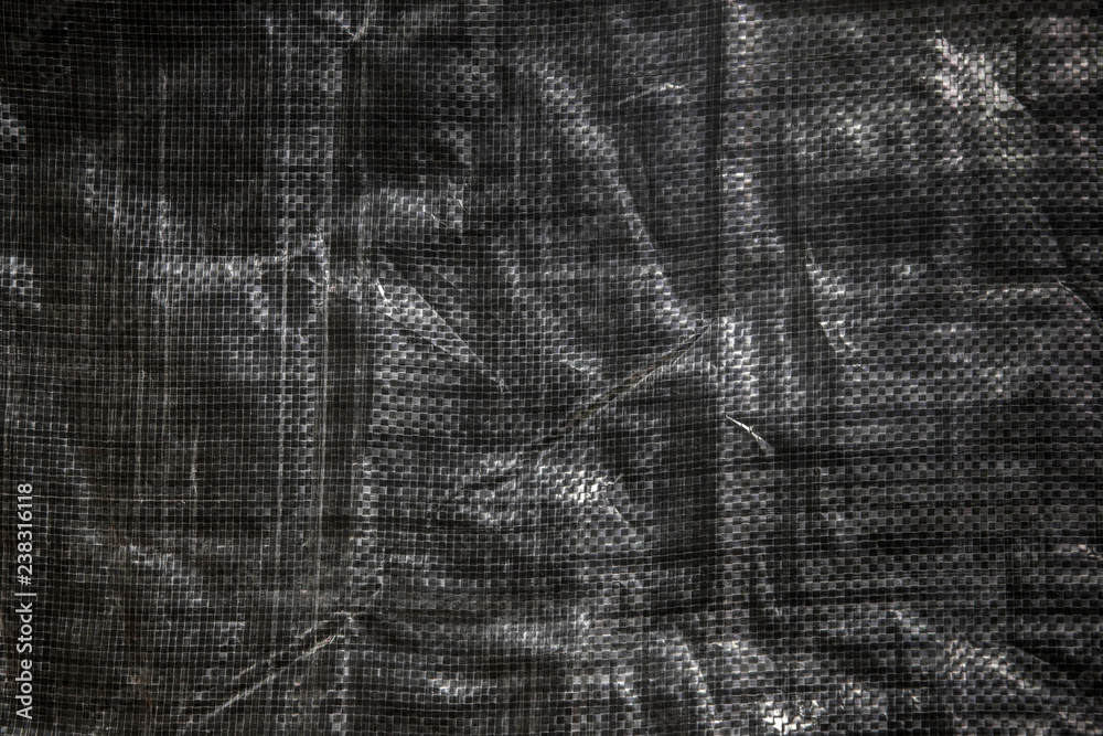 Stock-Foto „The texture of black crumpled polyethylene woven fabric ...