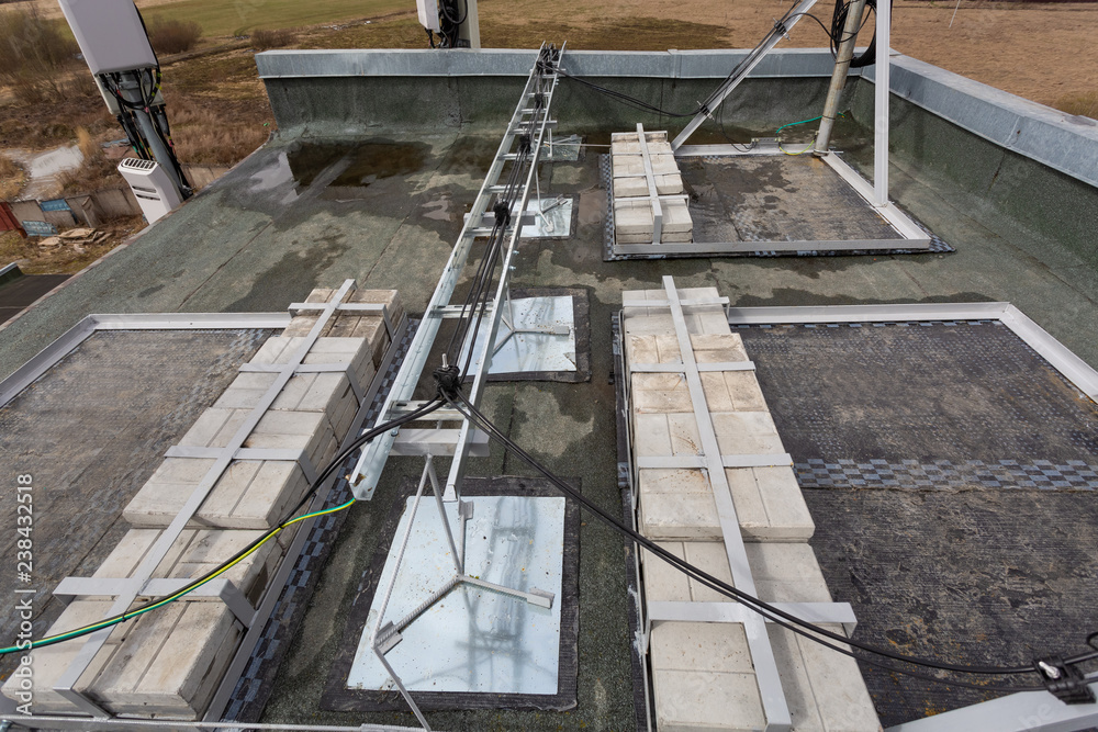 Panel antenna of GSM DCS UMTS LTE bands and radio unit are installed on ...