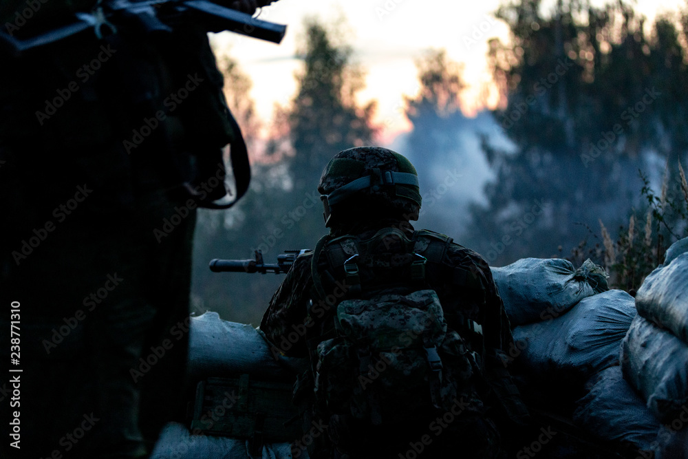 Sniper team armed with large caliber, sniper rifle, shooting enemy ...