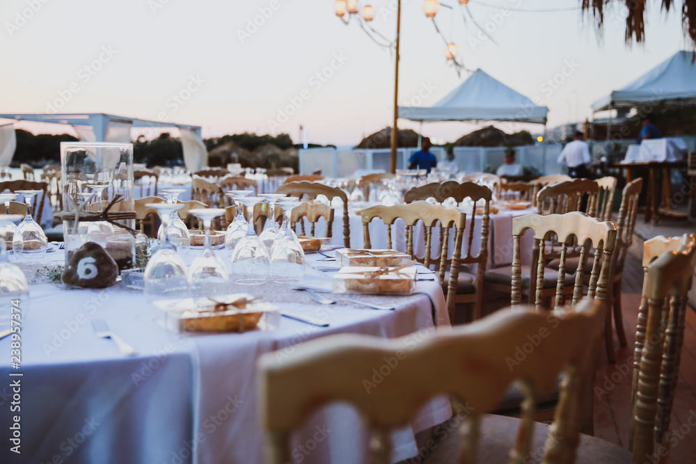 Elegance table set up for wedding in beige. Wedding dinner set up near ...