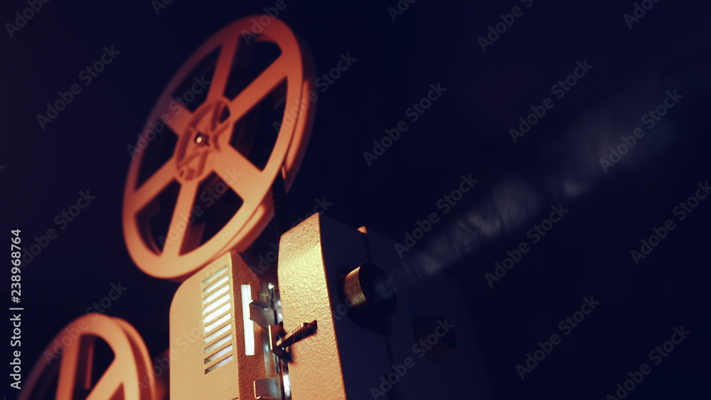 Vintage objects, cinematograph concept. Retro film projector playing in ...
