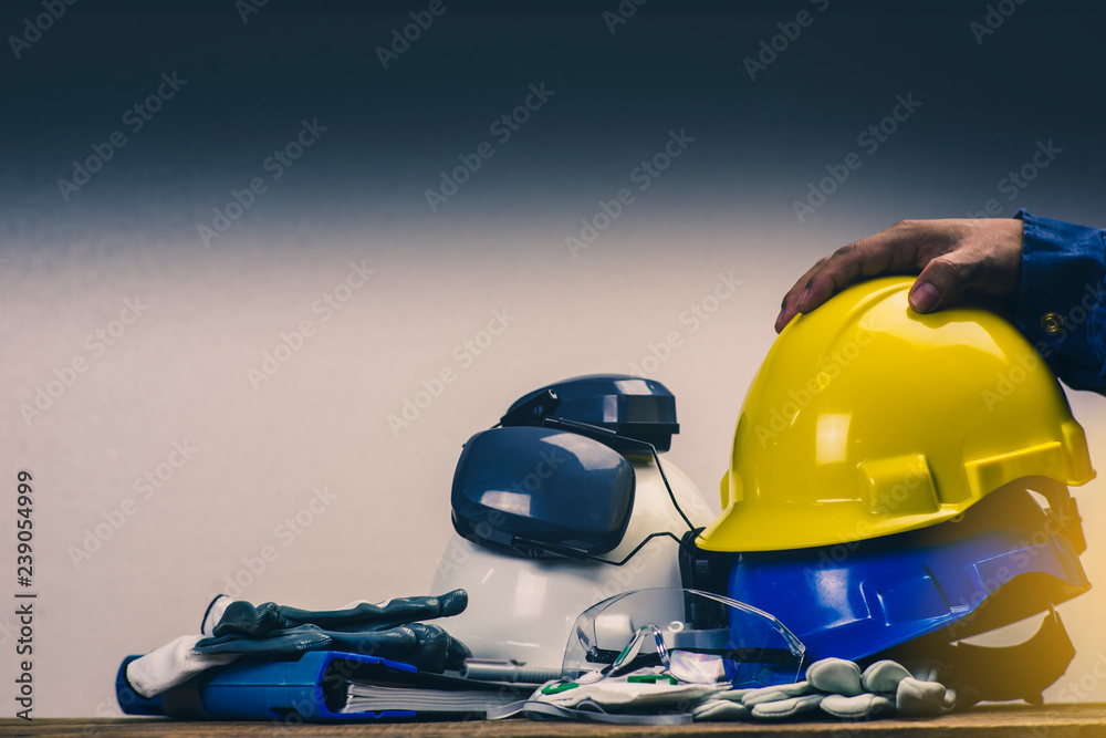 Works safety concept: PPE (Personal Protective Equipment), hard hat or ...