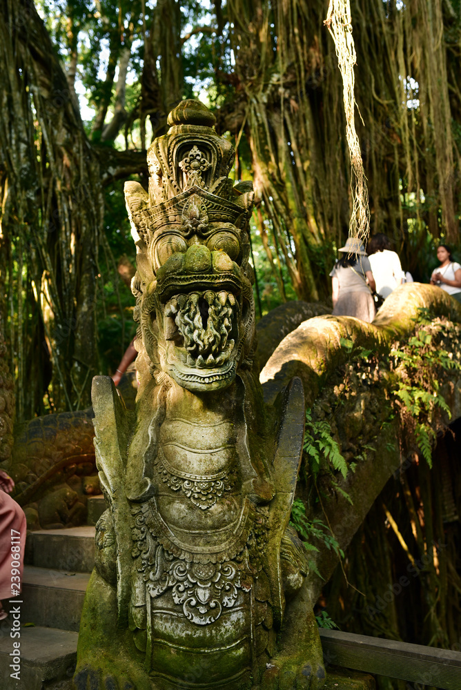 Statues and carvings depicting demons, gods and Balinese mythological ...