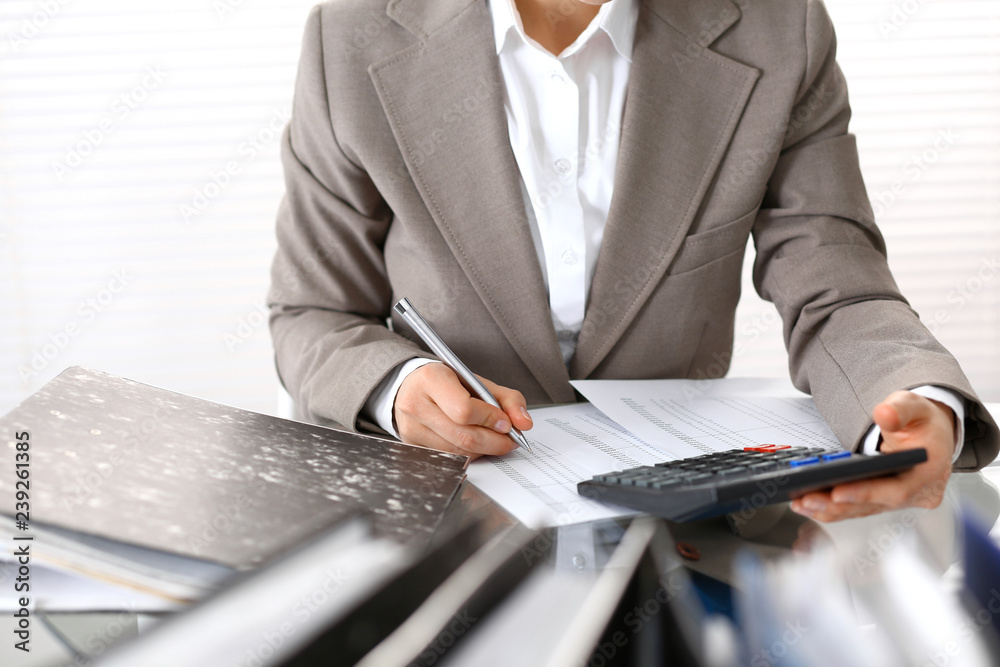 Bookkeeper woman or financial inspector making report, calculating or ...