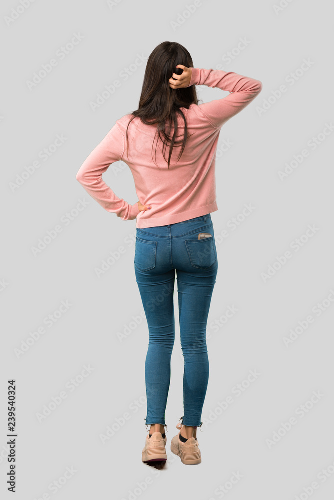 Full body of Teenager girl with pink shirt on back position looking ...