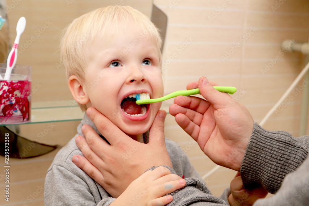 Dad and son brush their teeth in the bathroom. Father Brushing Teeth to ...
