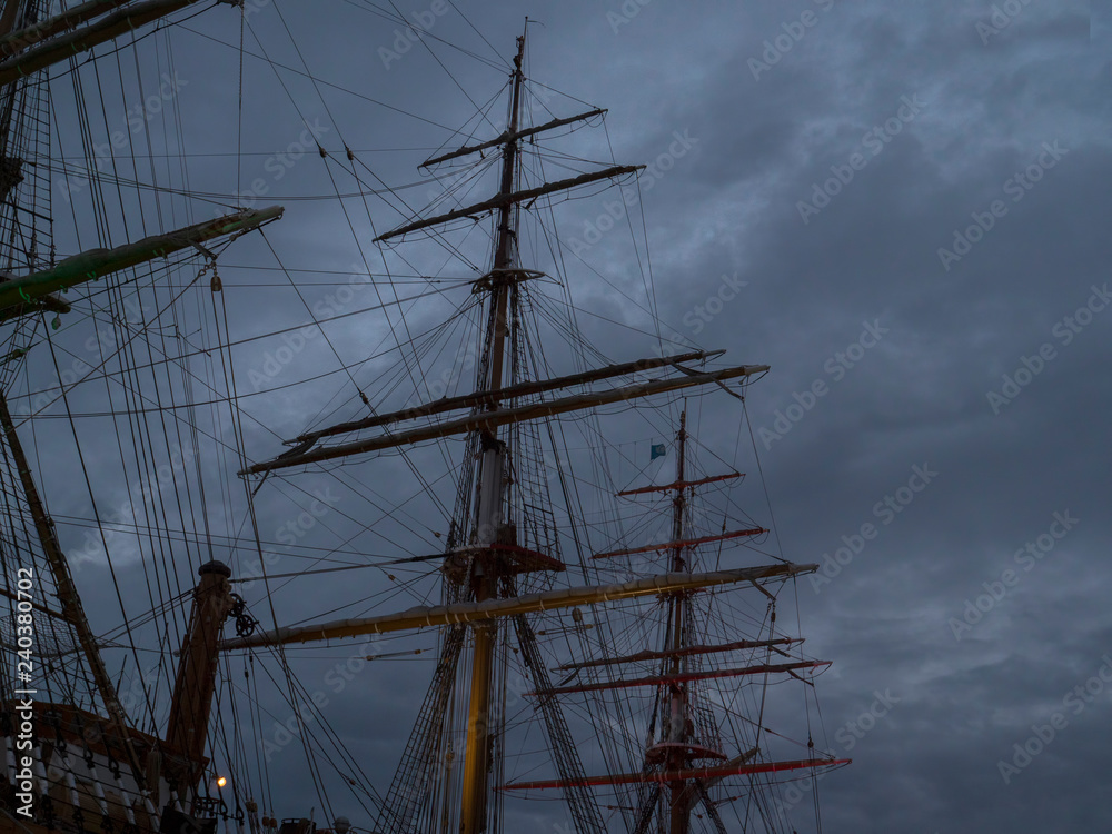 Masts and the rigging of ancient sailboat on nignt sky background ...