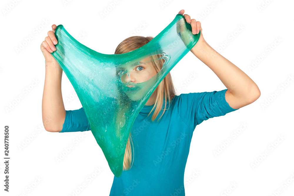 Funny girl holding a slime in front of her face and looking through its ...