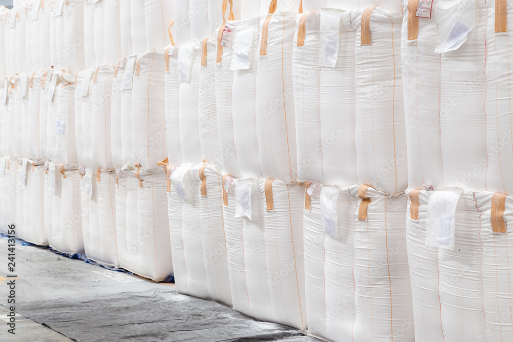 Stacking of bulk cargo in jumbo bags are store in warehouse for ...
