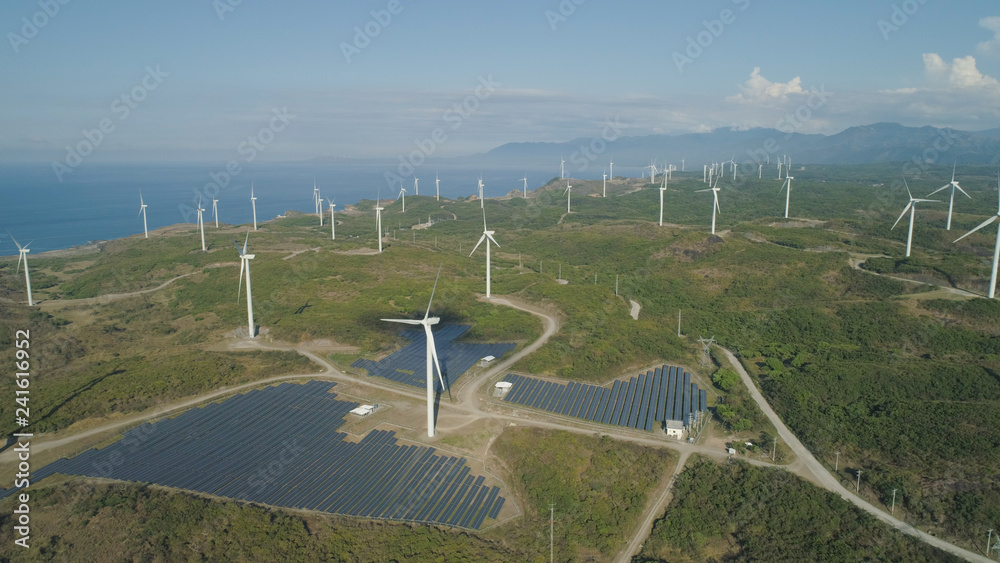 Aerial view of Windmills for electric power production on the seashore ...