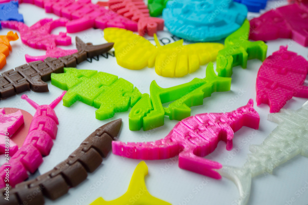 Foto de Stock Many bright multi-colored objects printed on 3d printer ...