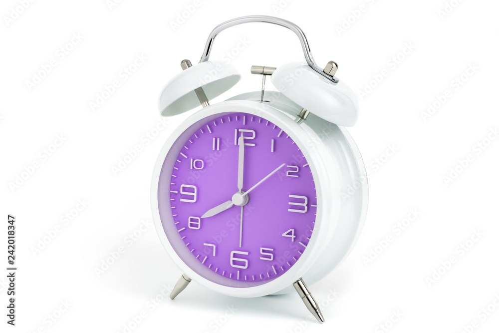 Twin bells analogue alarm clock with violet clock face shows eight o ...