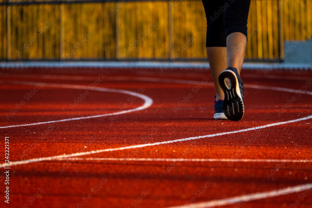 Red running track with runner's feet. Sport stadium for run. Stock ...