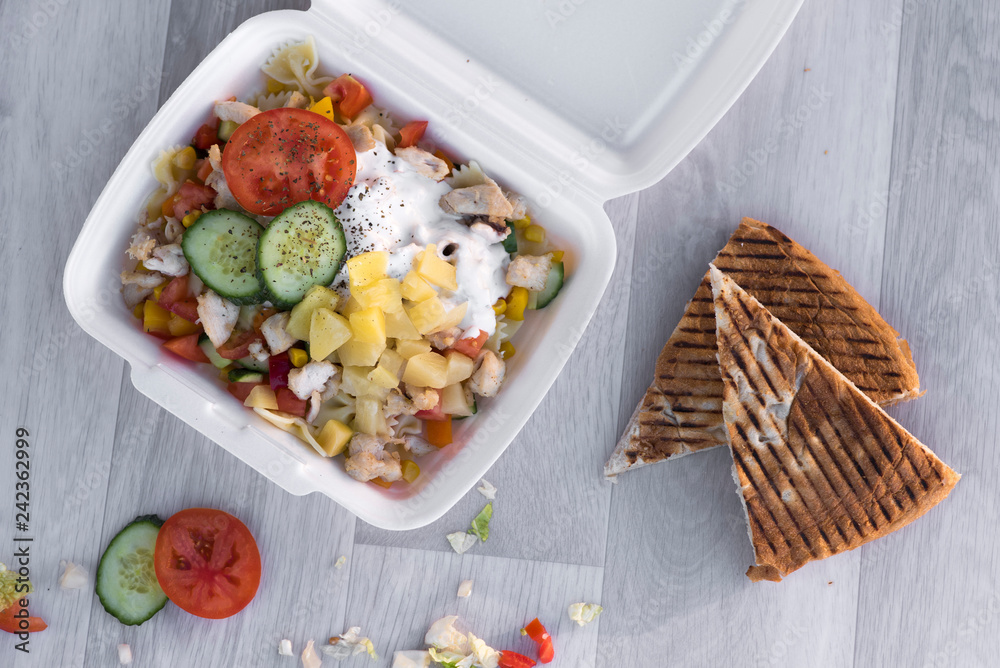 fast food vegetable salad with pineapple and cucumber in box Stock ...