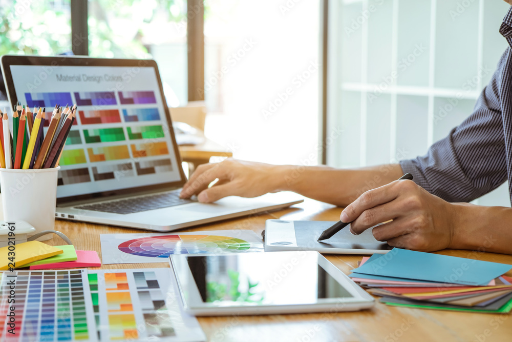 Young creative graphic designer working on project architectural ...