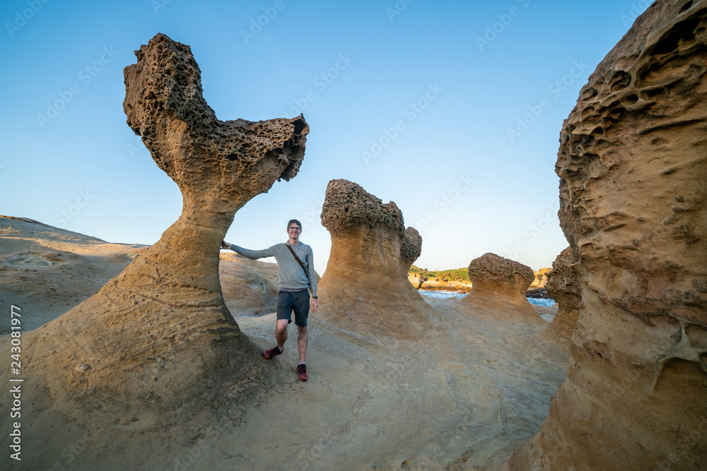 Young Traveler / Backpacker Man Posing in Yehliu Geopark in Taiwan ...