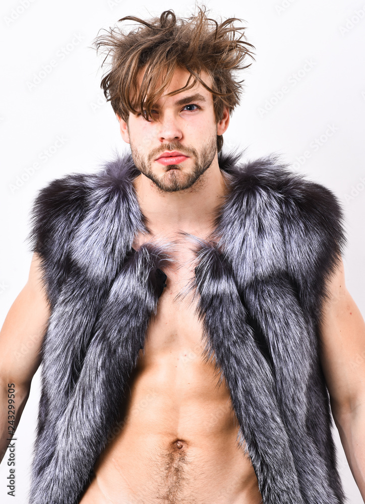 Sexy sleepy rich macho tousled hair fur vest on white background. Guy ...