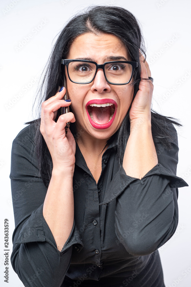 Afraid and shocked young business woman receiving bad news over her ...