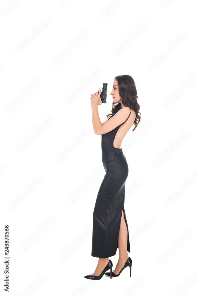 beautiful female killer in black dress holding gun, isolated on white ...