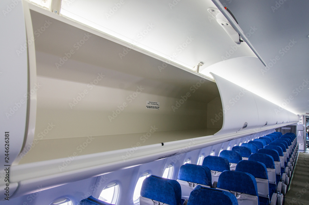 Open Luggage rack and interior view of the passenger airplane Stock ...