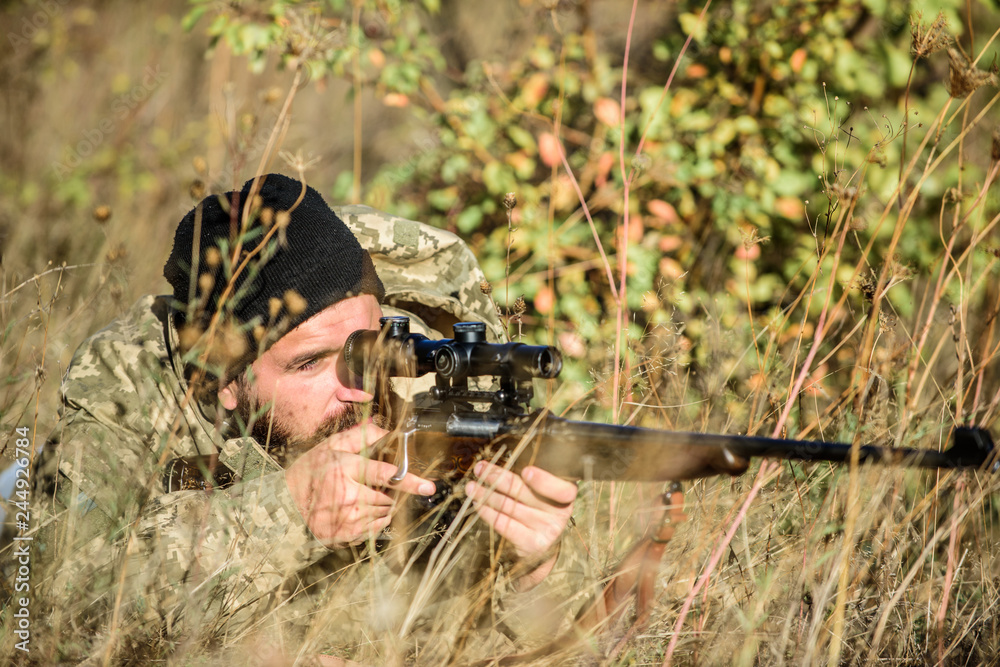 Fotografie Bearded man hunter. Military uniform fashion. Army forces ...