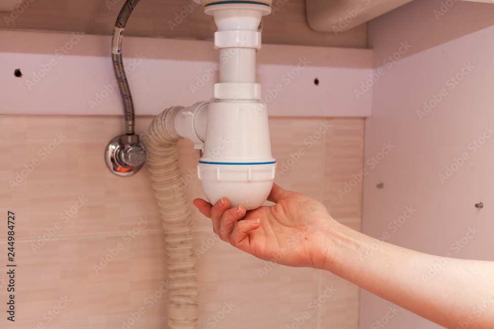 Clearing of blocked hammered polluted plastic U siphon for wash basin ...