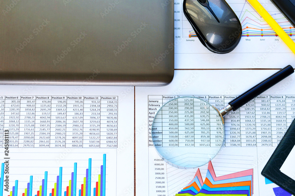 Financial documents - graphics, statistics, drawings, keyboard, laptop ...
