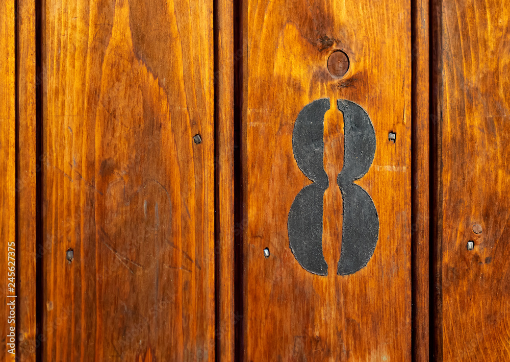 number 8 on door of storage room for tenants in century-old apartment ...