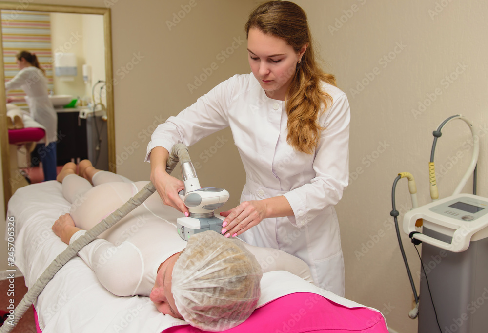 Lymphatic drainage massage LPG apparatus process. Woman getting anti ...